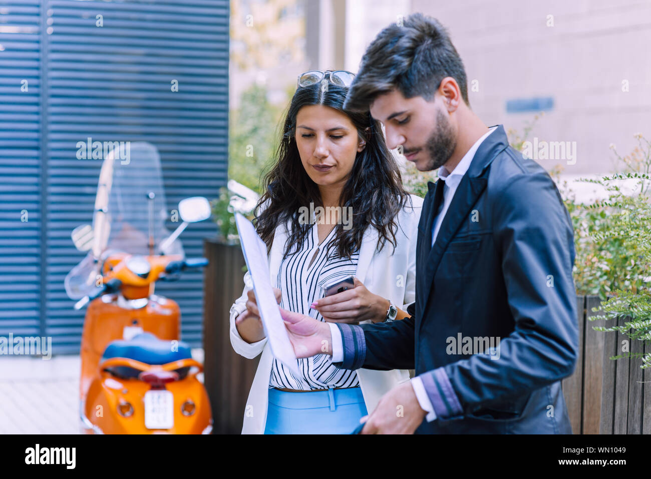 Picture of handsome man and beautiful woman as business partners Stock ...