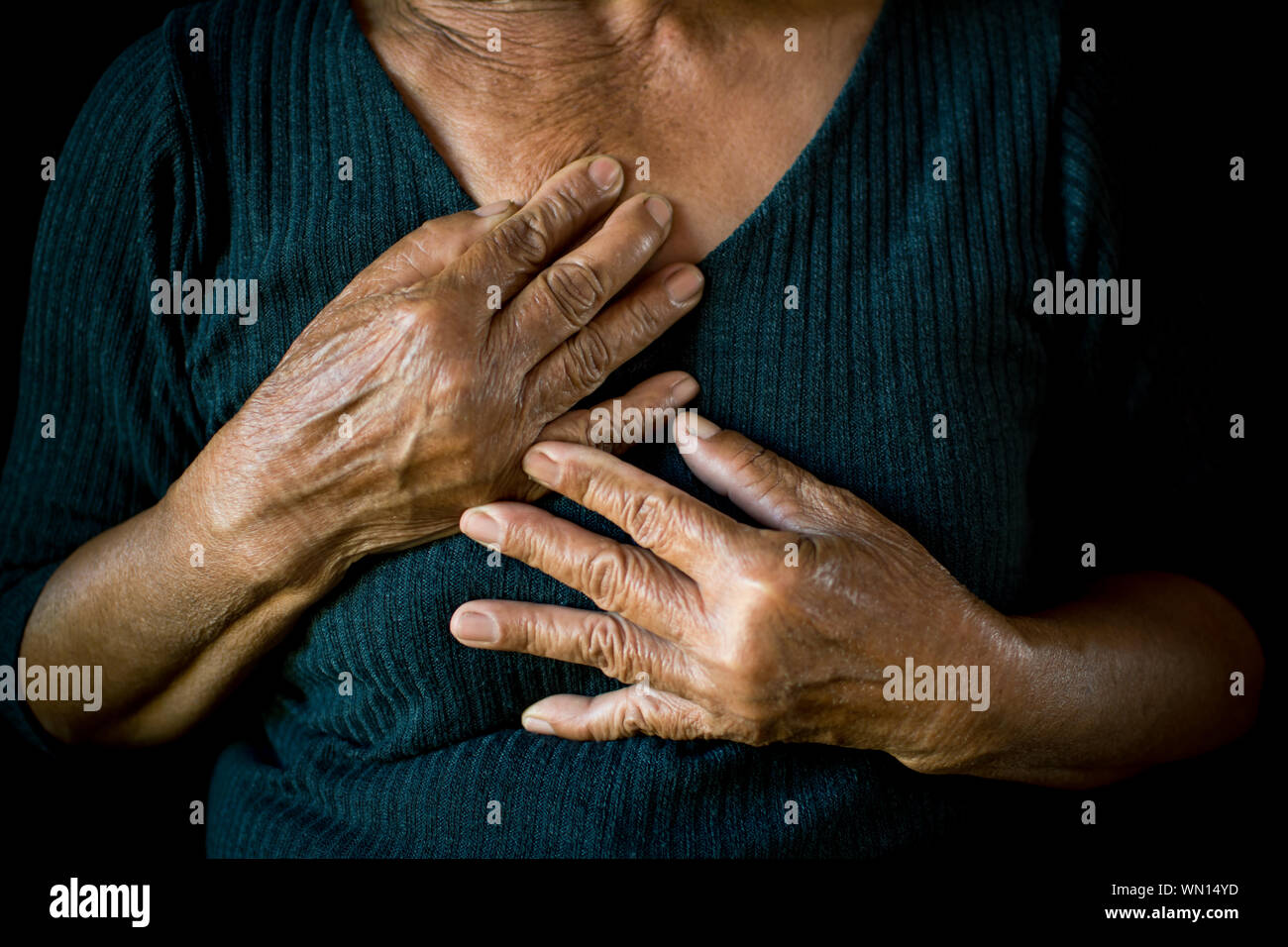 Hands on chest hi-res stock photography and images - Alamy
