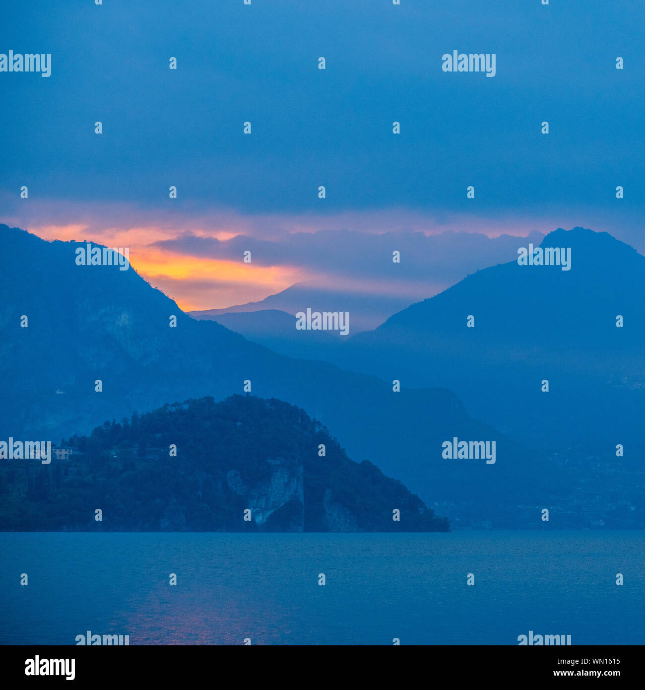 Sunset sky over mountains by Lake Como, Italy Stock Photo - Alamy