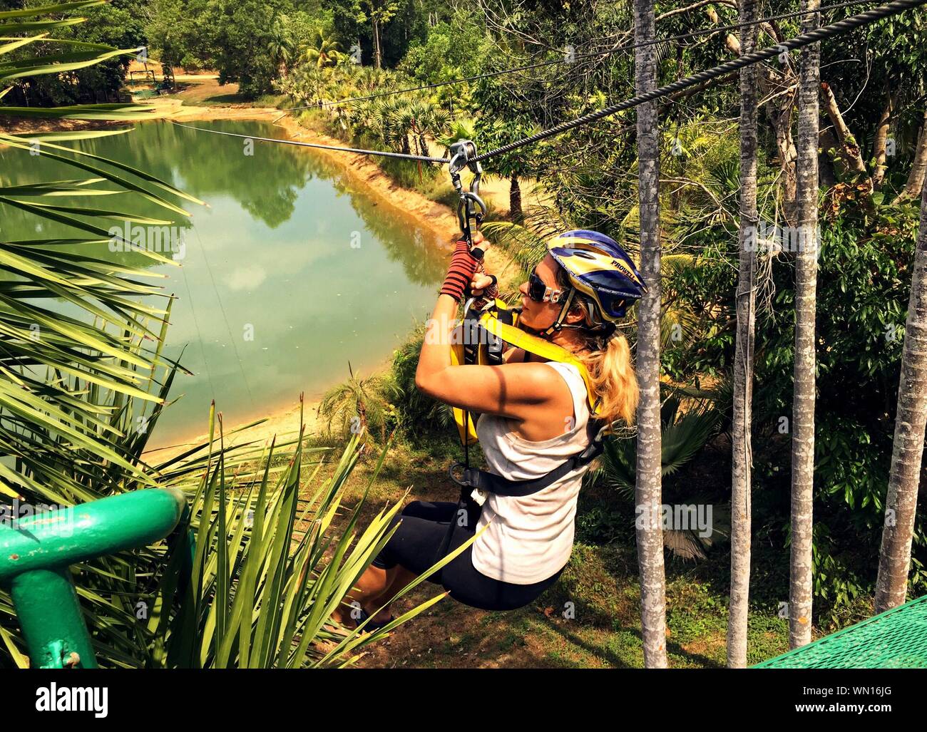 Person zip lining hi-res stock photography and images - Alamy