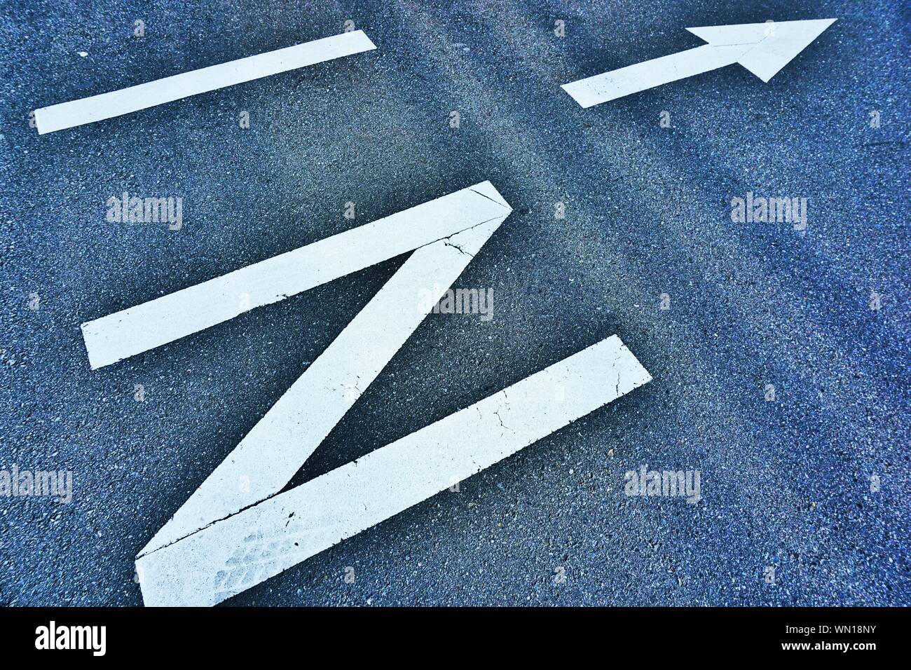 Directional road markings hi-res stock photography and images - Alamy