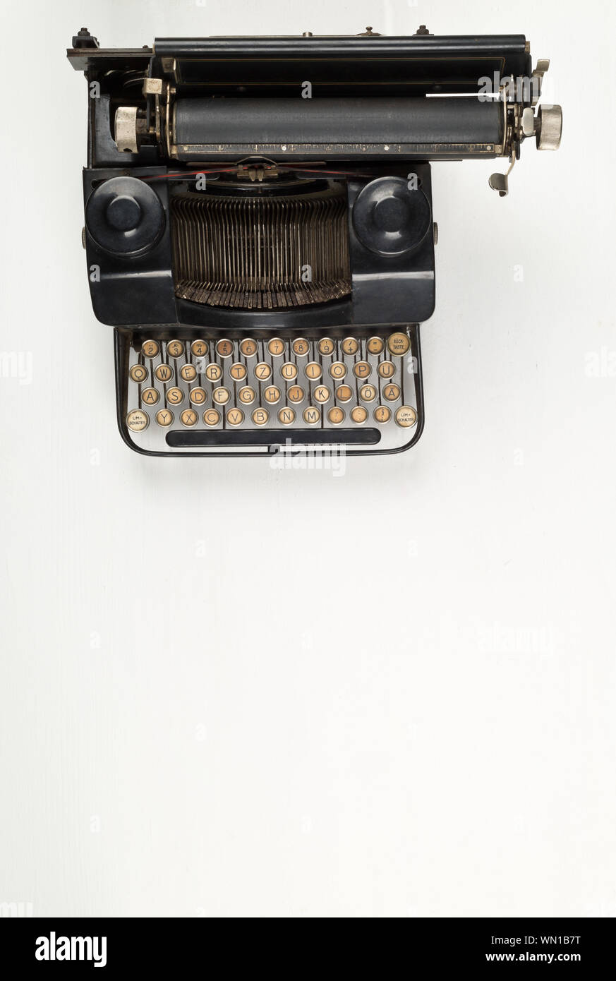 Vintage retro typewriter on white wooden table background top view flat ...