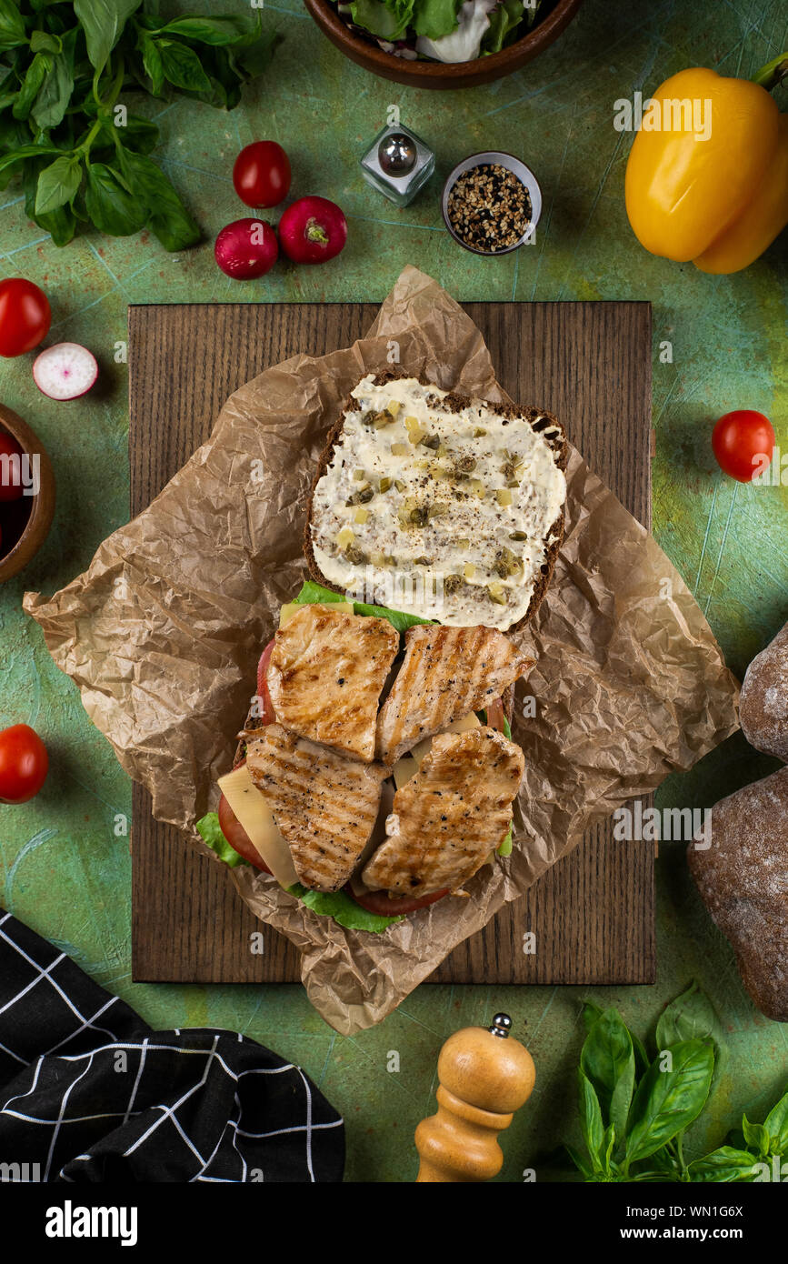 Open chicken sandwich Stock Photo - Alamy
