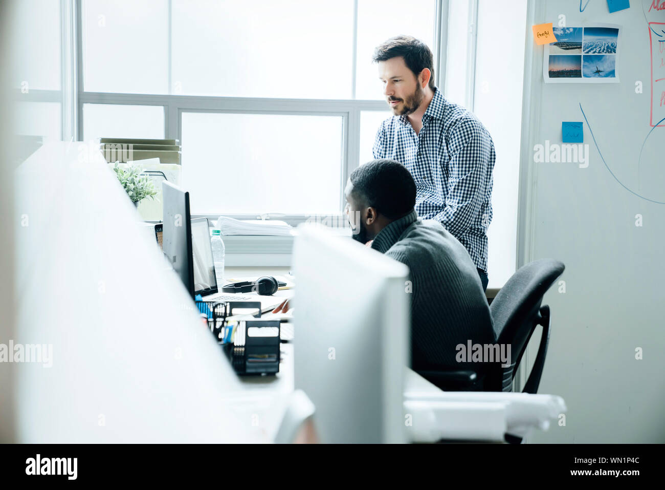 Men using computer in office Stock Photo - Alamy