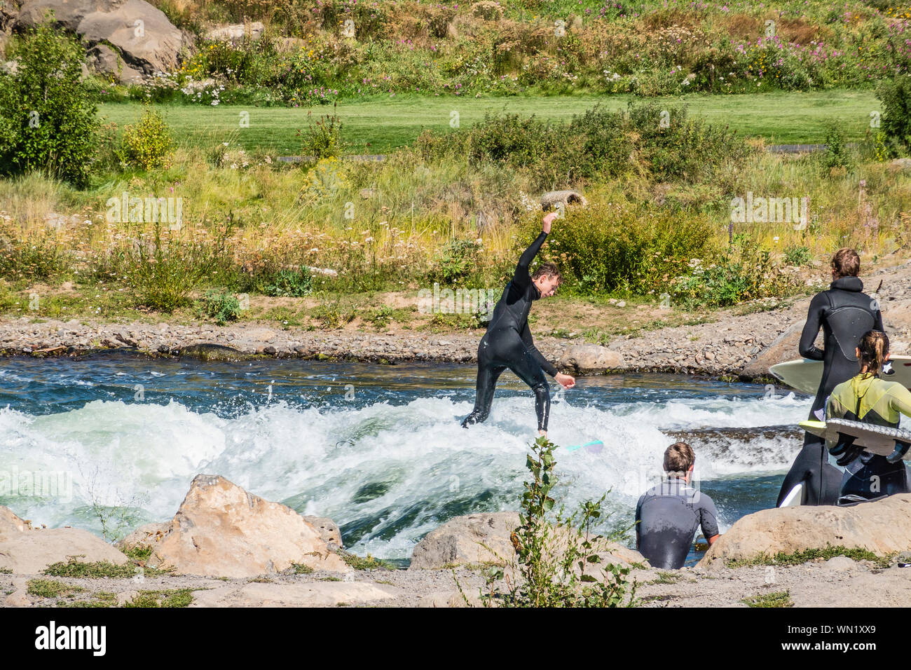 River surfing on the Deschutes River in Bend, Oregon. River surfing is ...