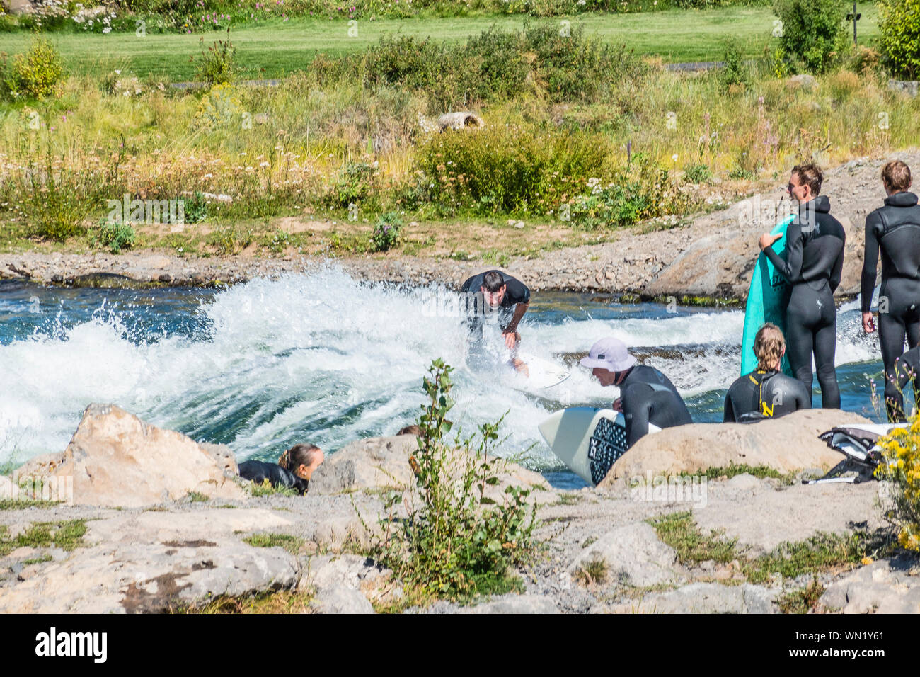 River surfing on the Deschutes River in Bend, Oregon. River surfing is ...