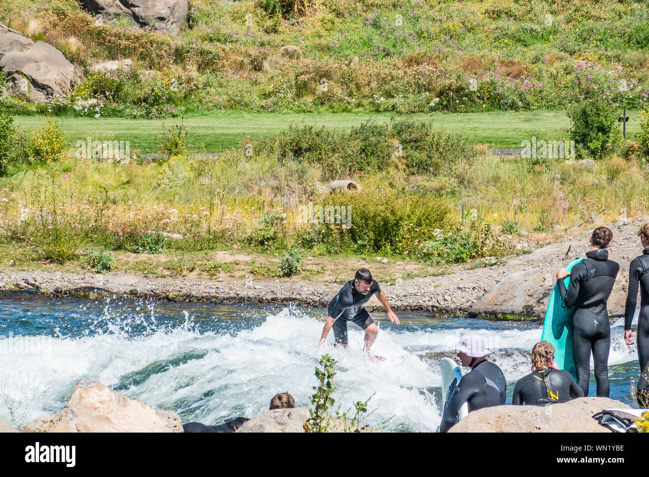 River surfing on the Deschutes River in Bend, Oregon. River surfing is ...