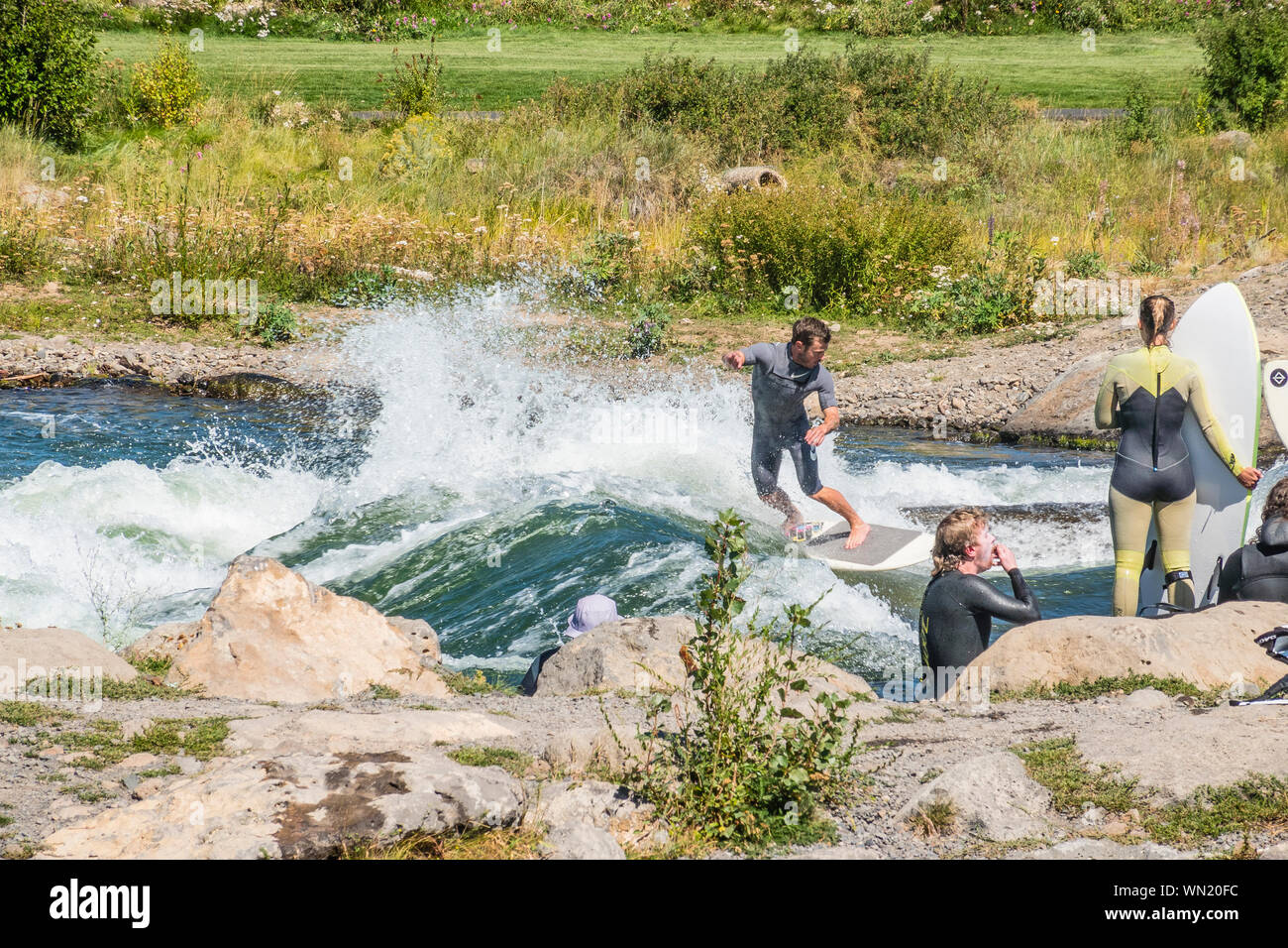 River surfing on the Deschutes River in Bend, Oregon. River surfing is ...