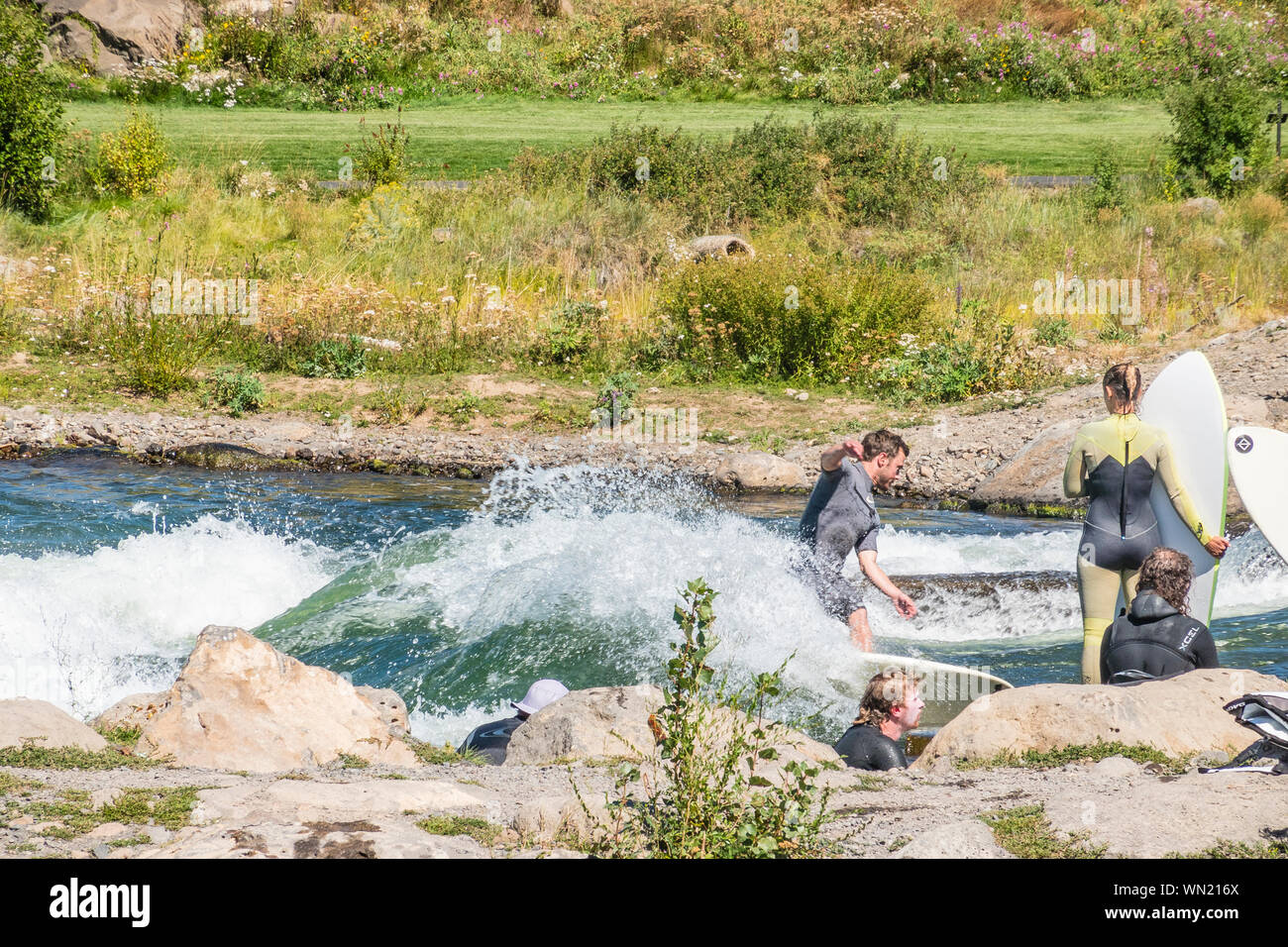 River surfing on the Deschutes River in Bend, Oregon. River surfing is ...
