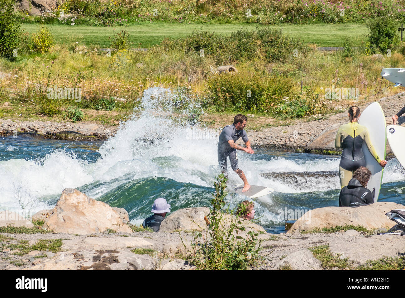 River surfing on the Deschutes River in Bend, Oregon. River surfing is ...