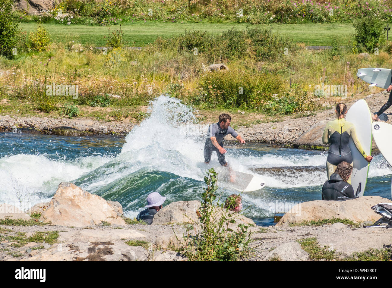 River surfing on the Deschutes River in Bend, Oregon. River surfing is ...
