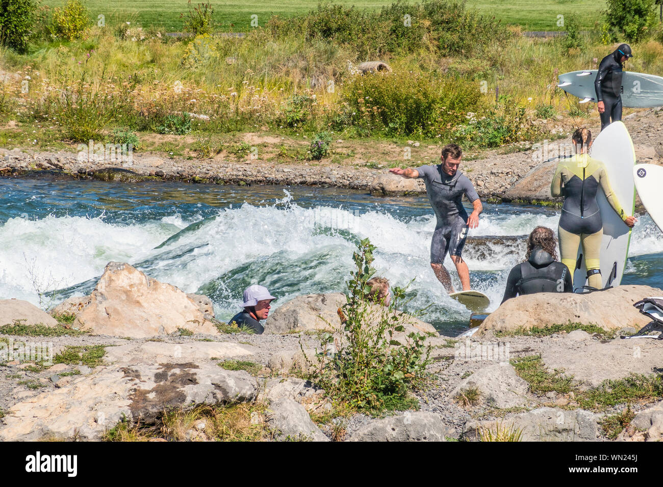 River surfing on the Deschutes River in Bend, Oregon. River surfing is ...