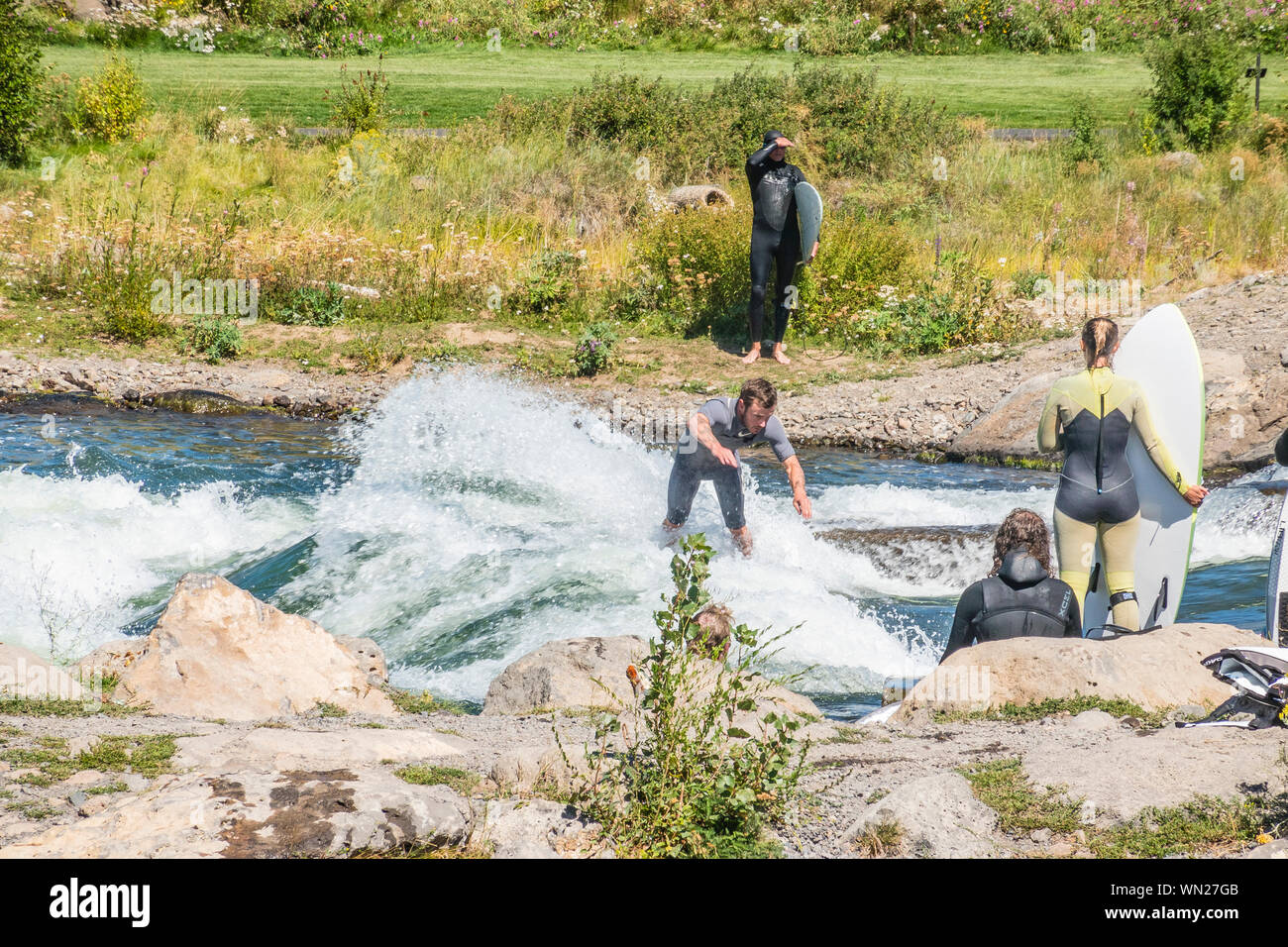 River surfing on the Deschutes River in Bend, Oregon. River surfing is ...