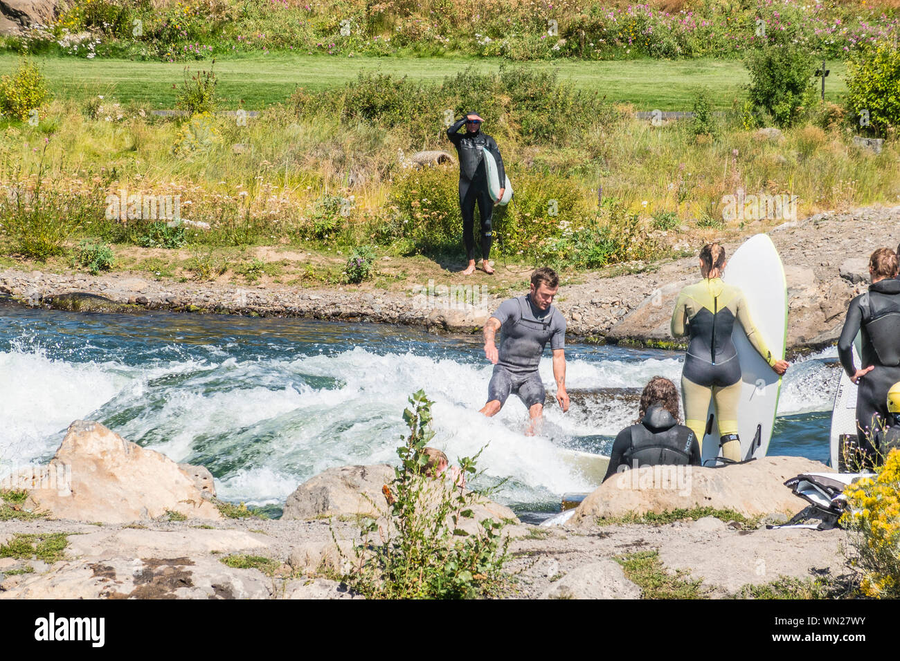 River surfing on the Deschutes River in Bend, Oregon. River surfing is ...