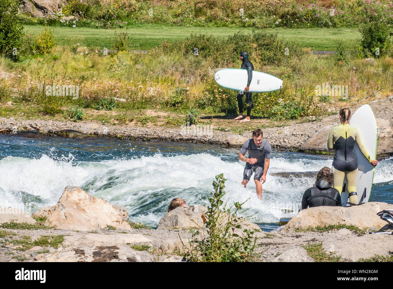 River surfing on the Deschutes River in Bend, Oregon. River surfing is ...