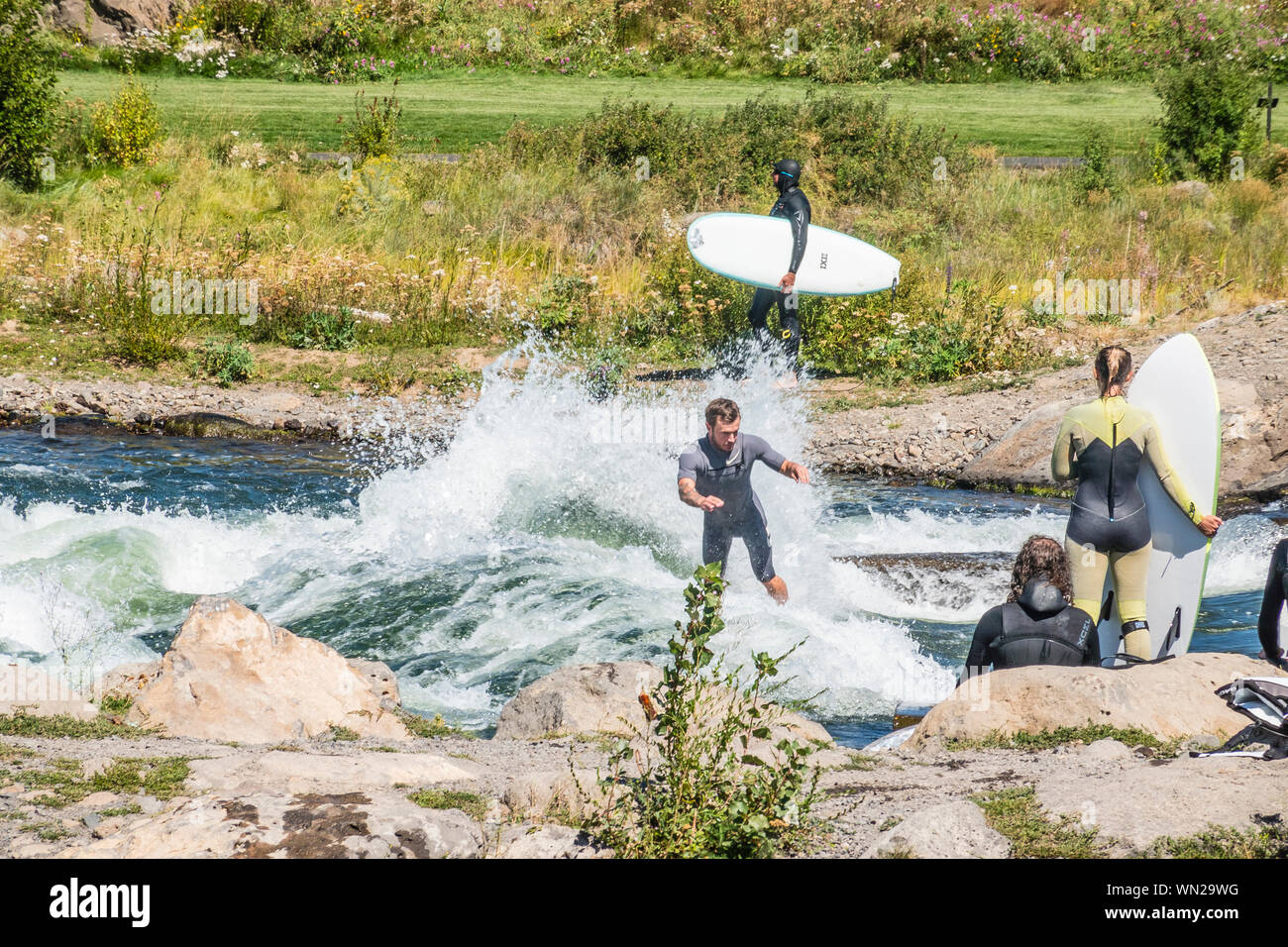 River surfing on the Deschutes River in Bend, Oregon. River surfing is ...