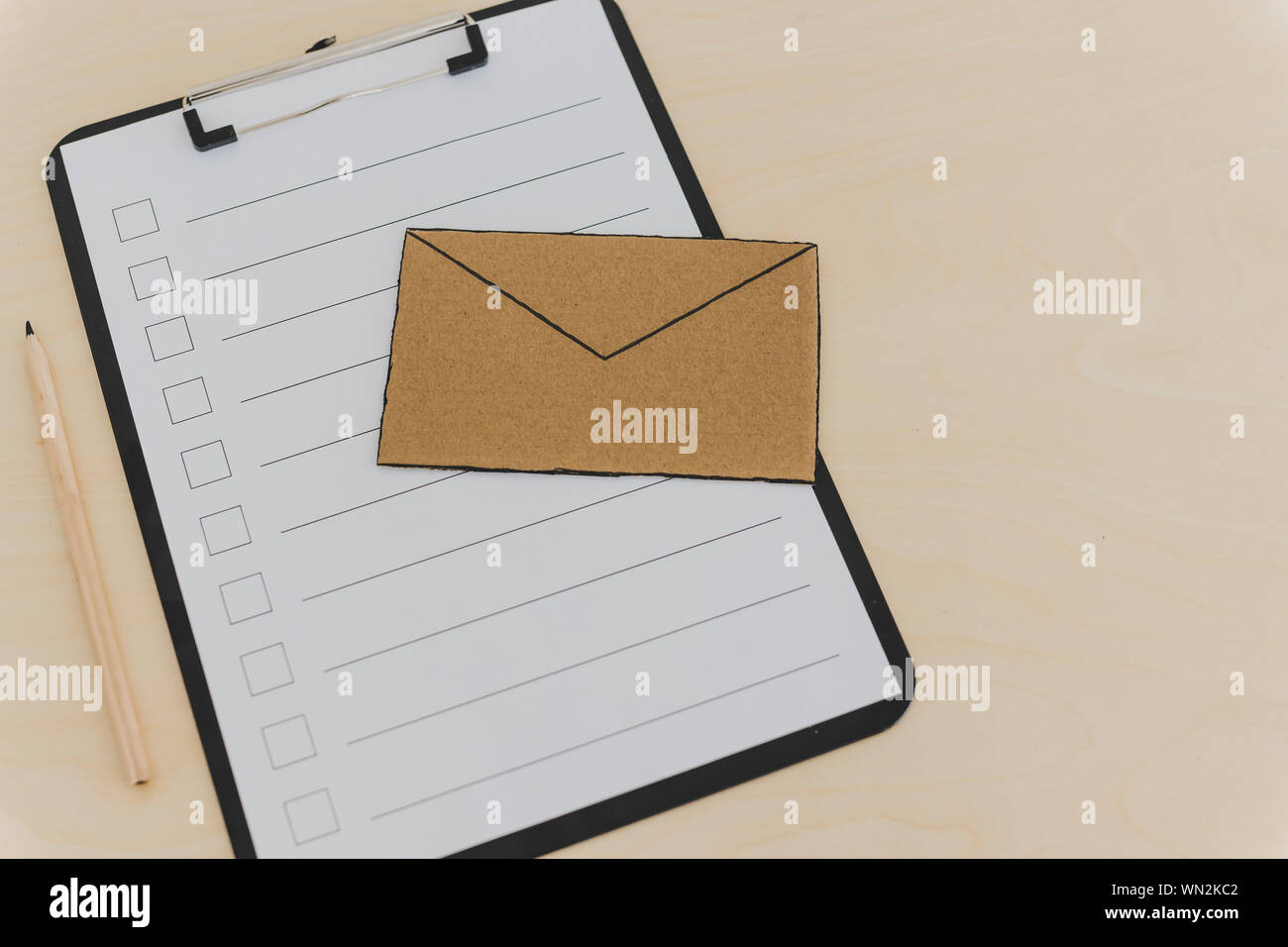 inbox stress concept, email miniature next to blank to do checklist on ...