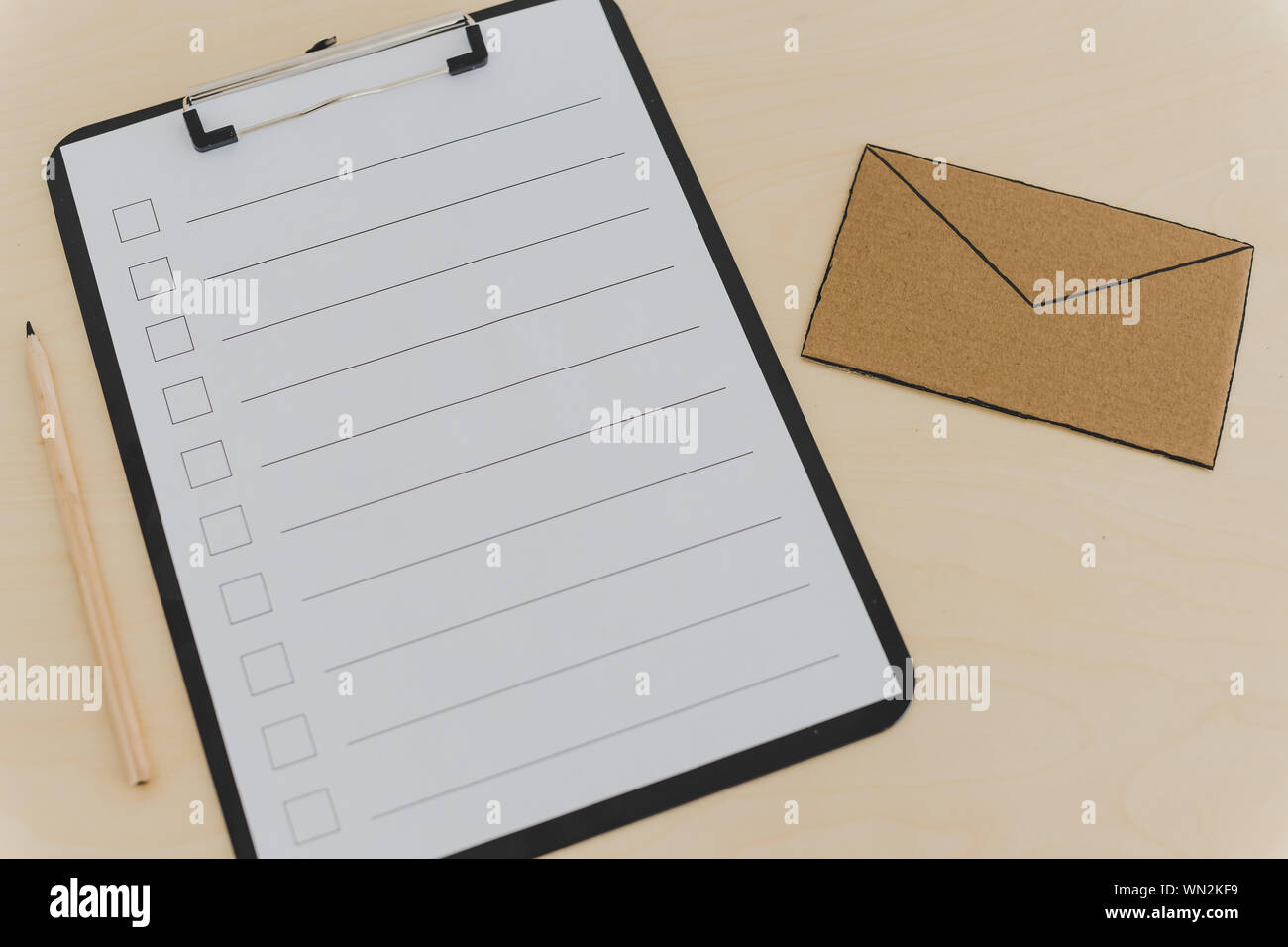 inbox stress concept, email miniature next to blank to do checklist on ...