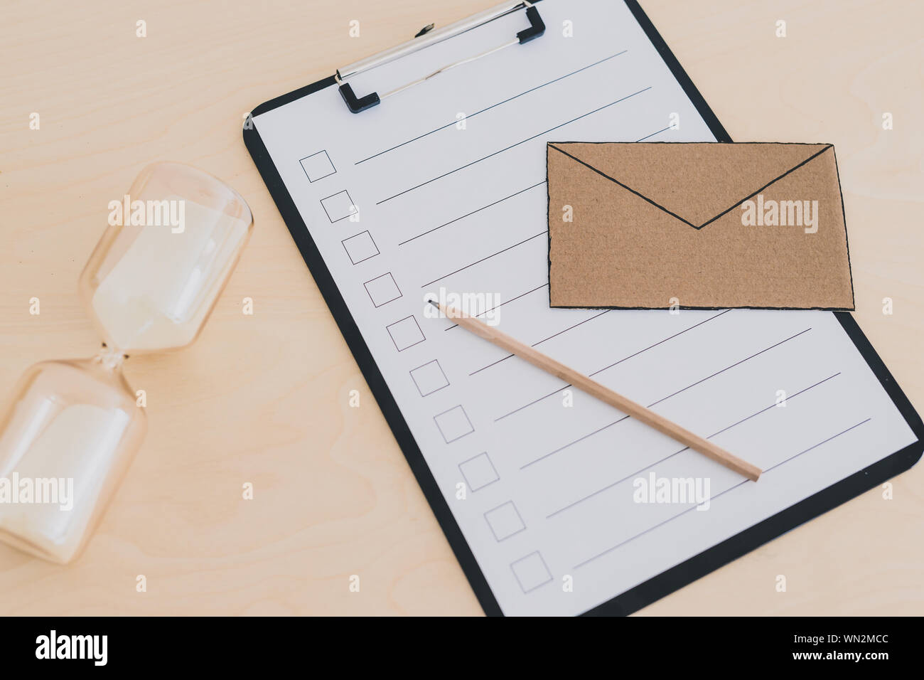 inbox stress concept, email miniature next to blank to do checklist ...