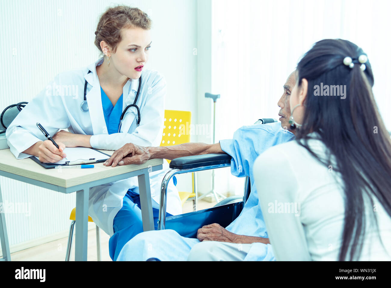 Young professional female doctor helping hands ,explaining diagnosis to ...