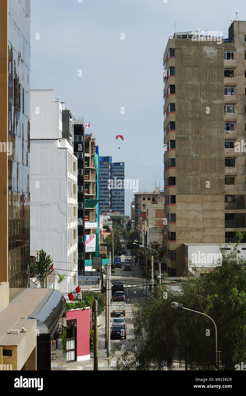 LIMA, PERU - AUGUST 7, 2010: View onto the street Calle Ocharan with a ...
