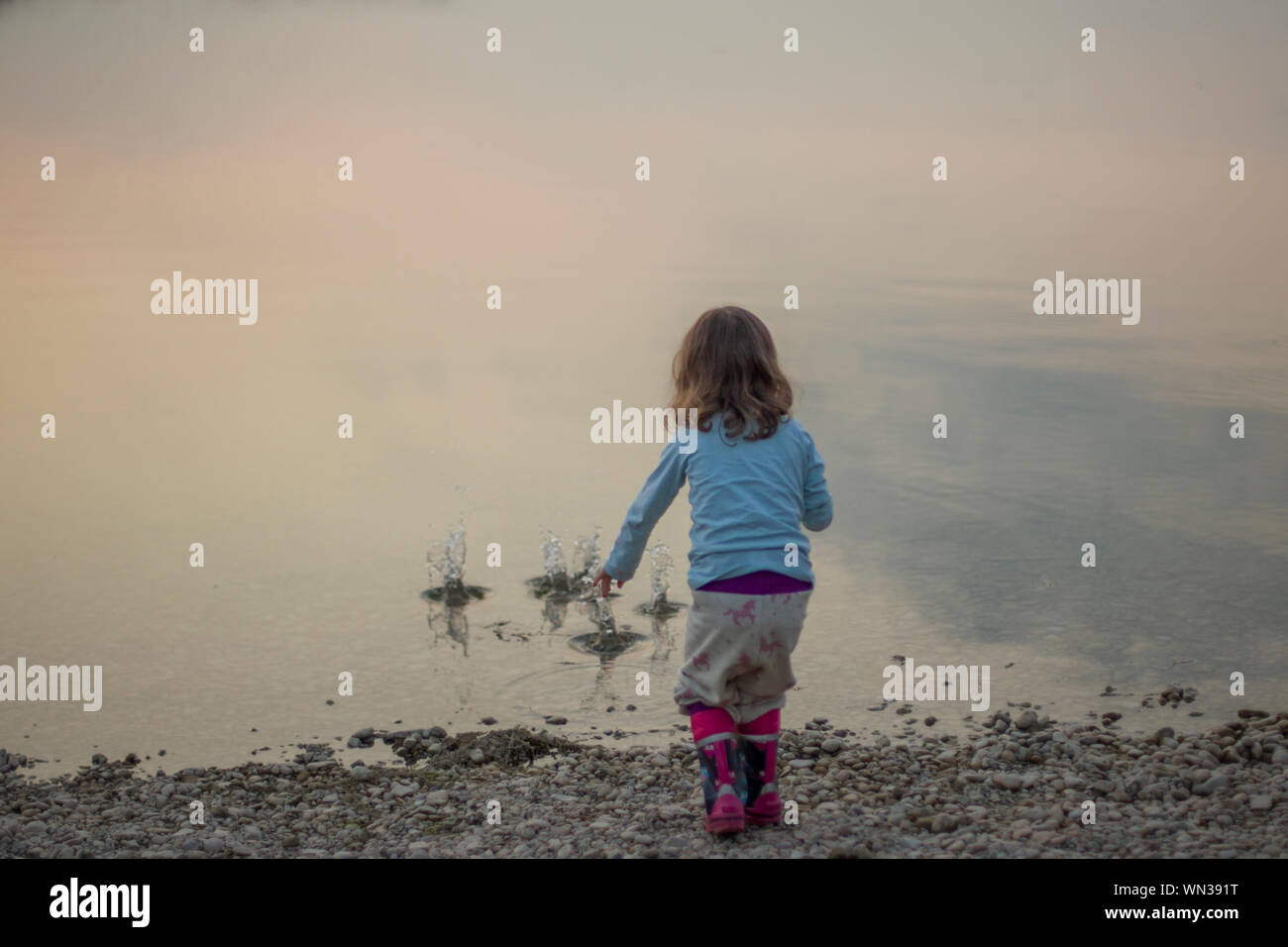 Girl walking at sunset hi-res stock photography and images - Alamy