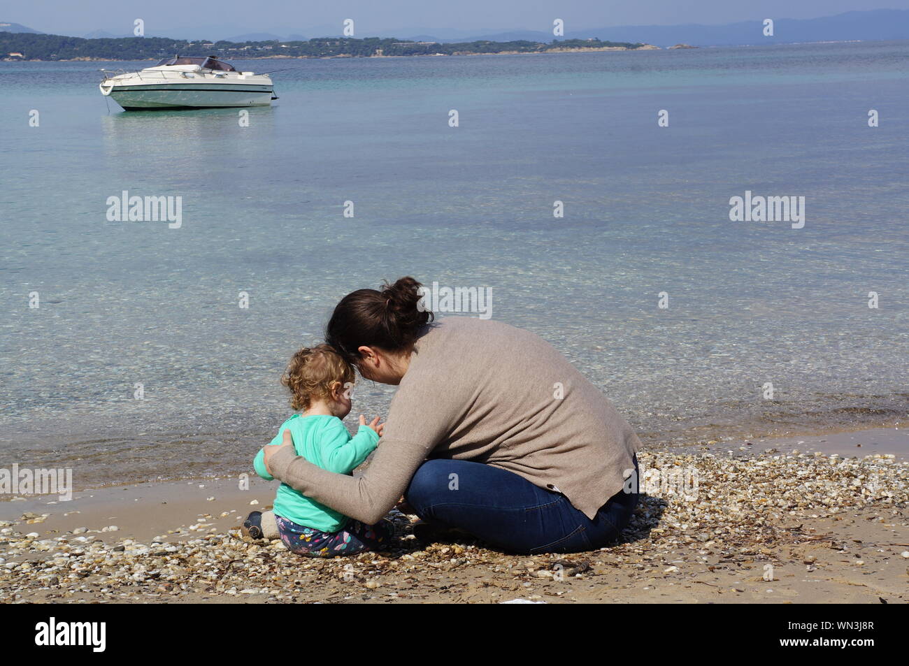 Woman and baby on the beach hi-res stock photography and images - Alamy