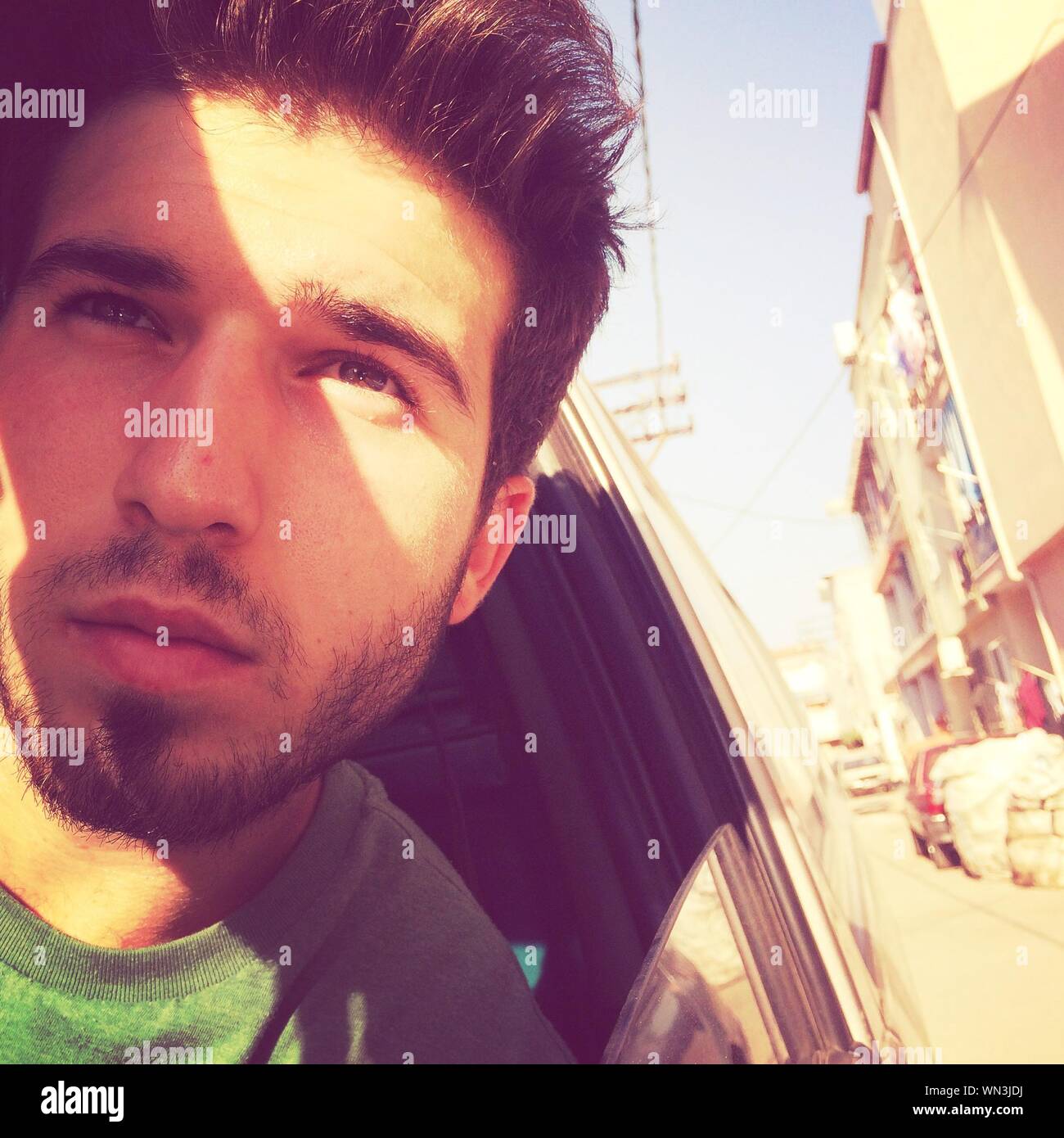 Man leaning out window hi-res stock photography and images - Alamy