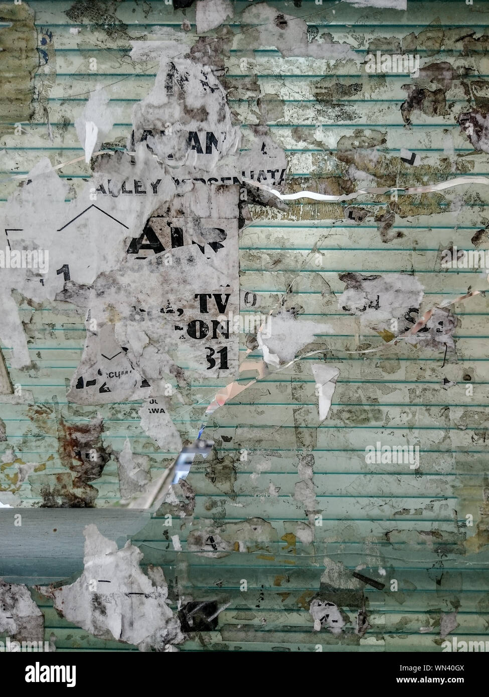 Torn posters on brick hi-res stock photography and images - Alamy