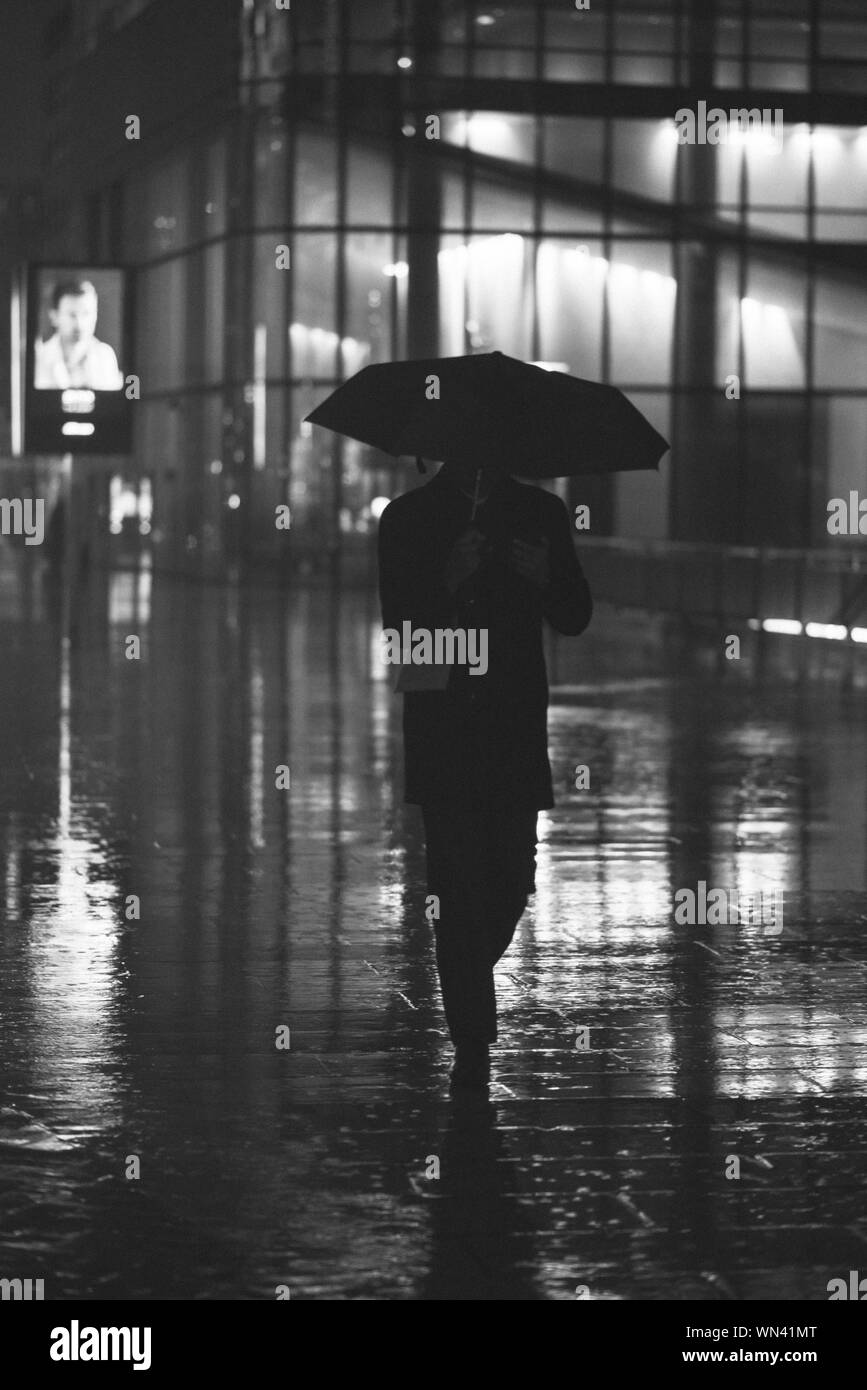 Man Walking In The Rain