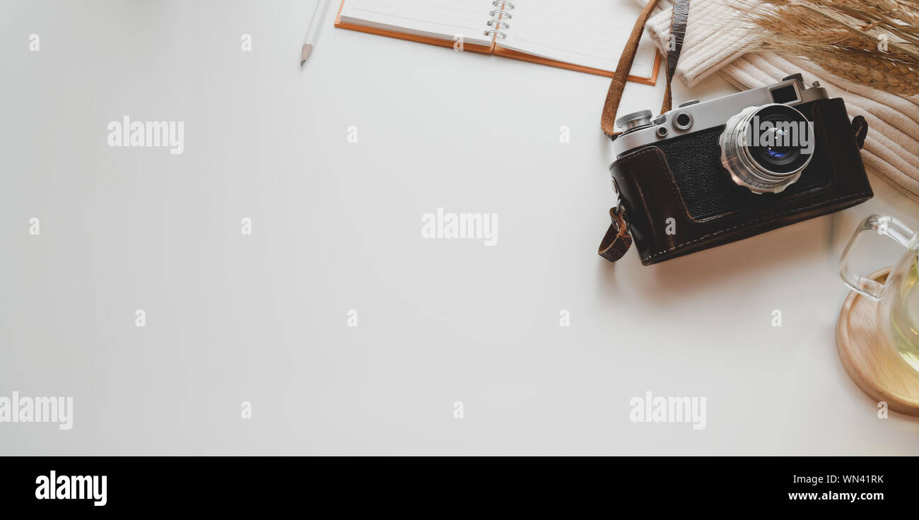 Modern photographer workplace with camera, office supplies and copy ...