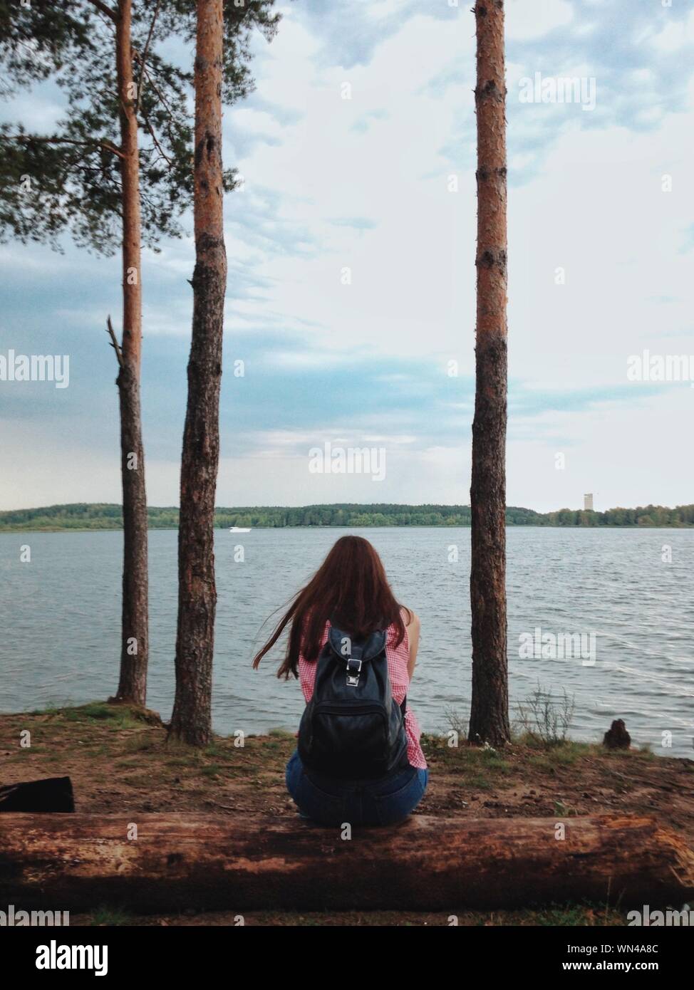 Woman Sitting Against Tree Trunk High Resolution Stock Photography and ...