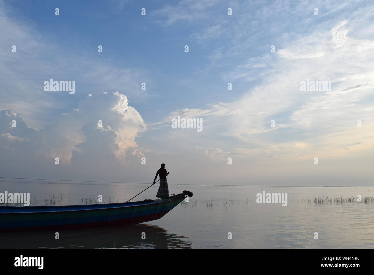 Man Standing On Boat Stock Photo - Alamy