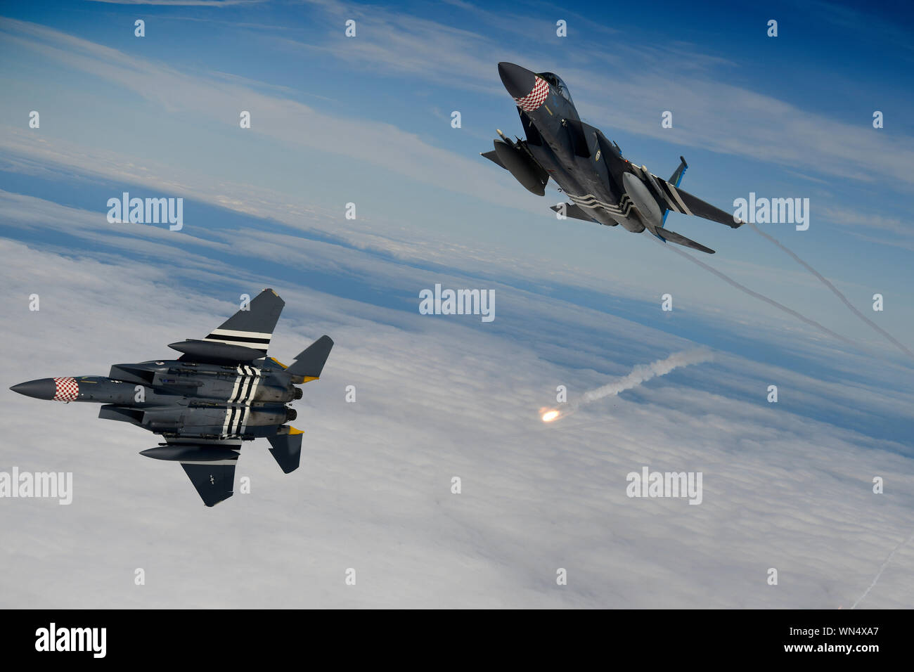 An F-15E Strike Eagle and an F-15C Eagle assigned to the 48th Fighter ...