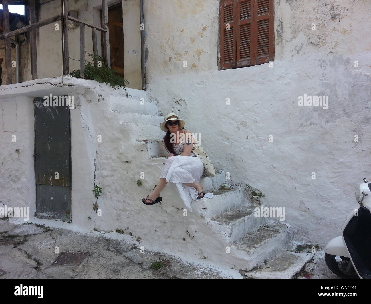 Woman steps sitting house hi-res stock photography and images - Alamy