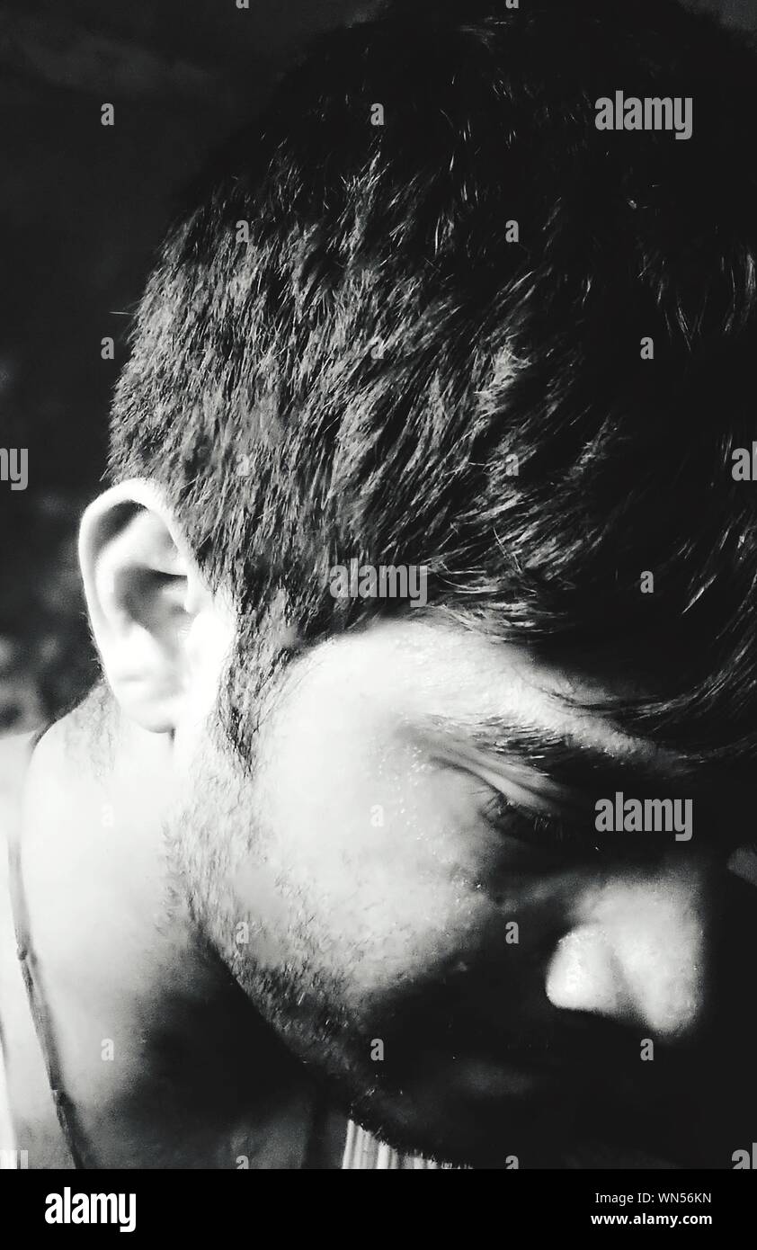 Young man looking down sadness hi-res stock photography and images - Alamy