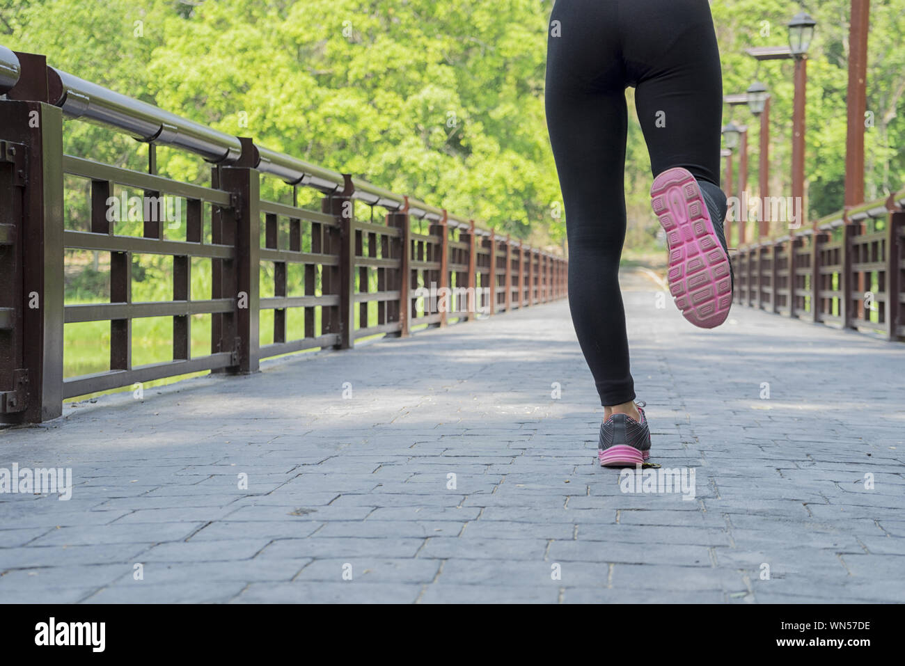 Woman jogging low angle hi-res stock photography and images - Alamy