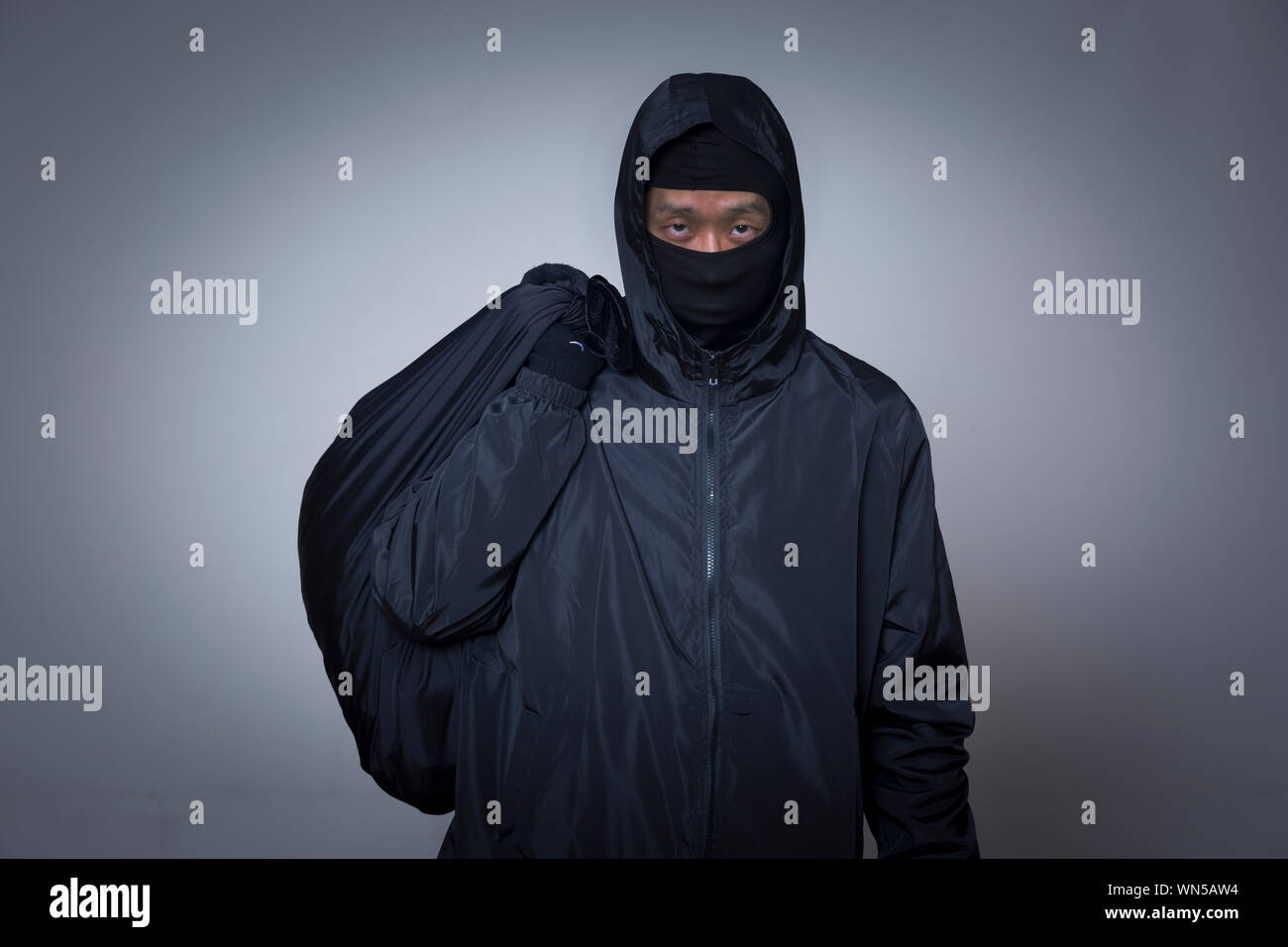 Thief in black cap hi-res stock photography and images - Alamy
