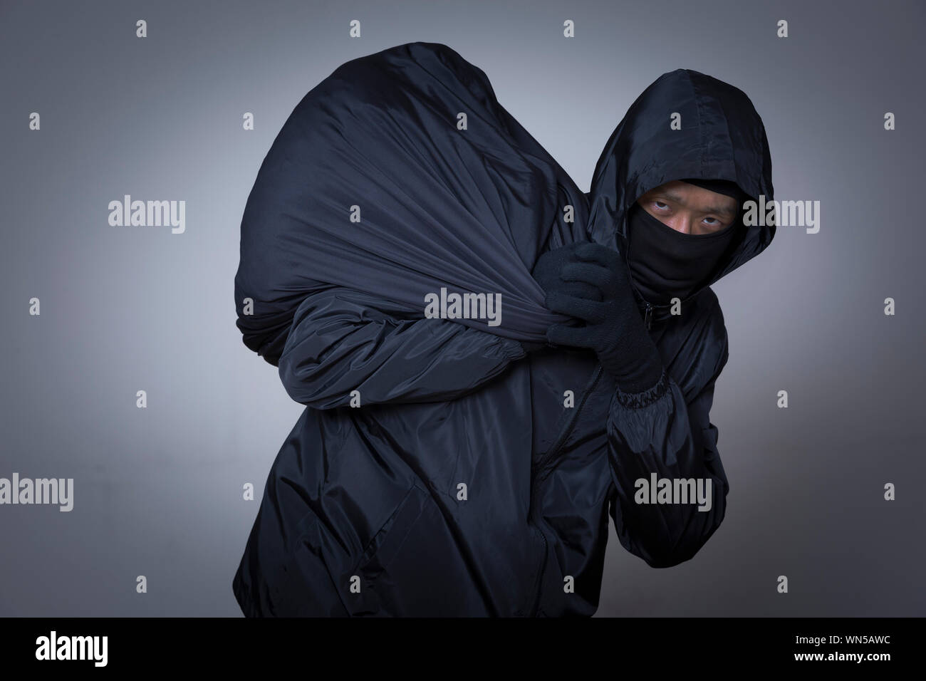 Thief in black cap hi-res stock photography and images - Alamy