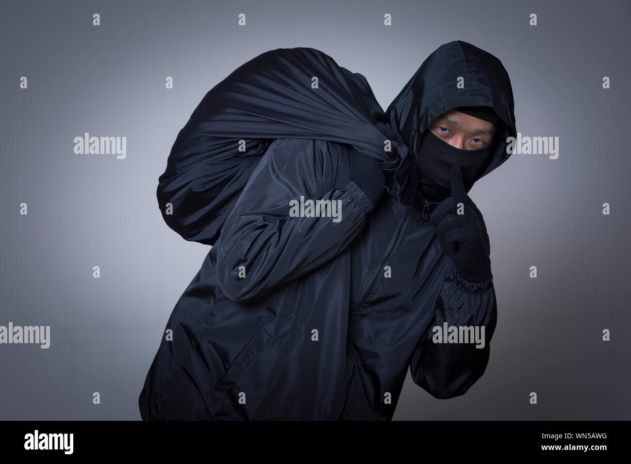Thief in black cap hi-res stock photography and images - Alamy