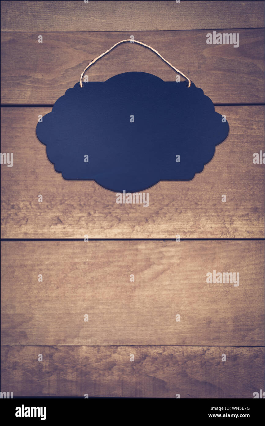 Black Empty Sign Board with string for hanging on wall Stock Photo - Alamy