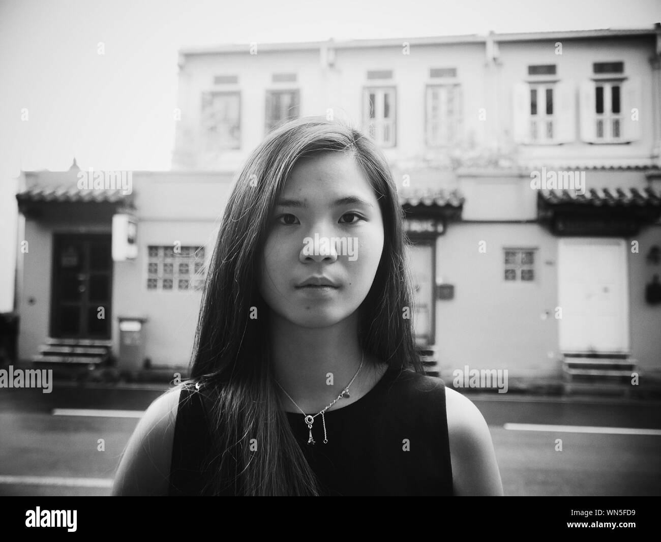Woman standing roadside hi-res stock photography and images - Alamy