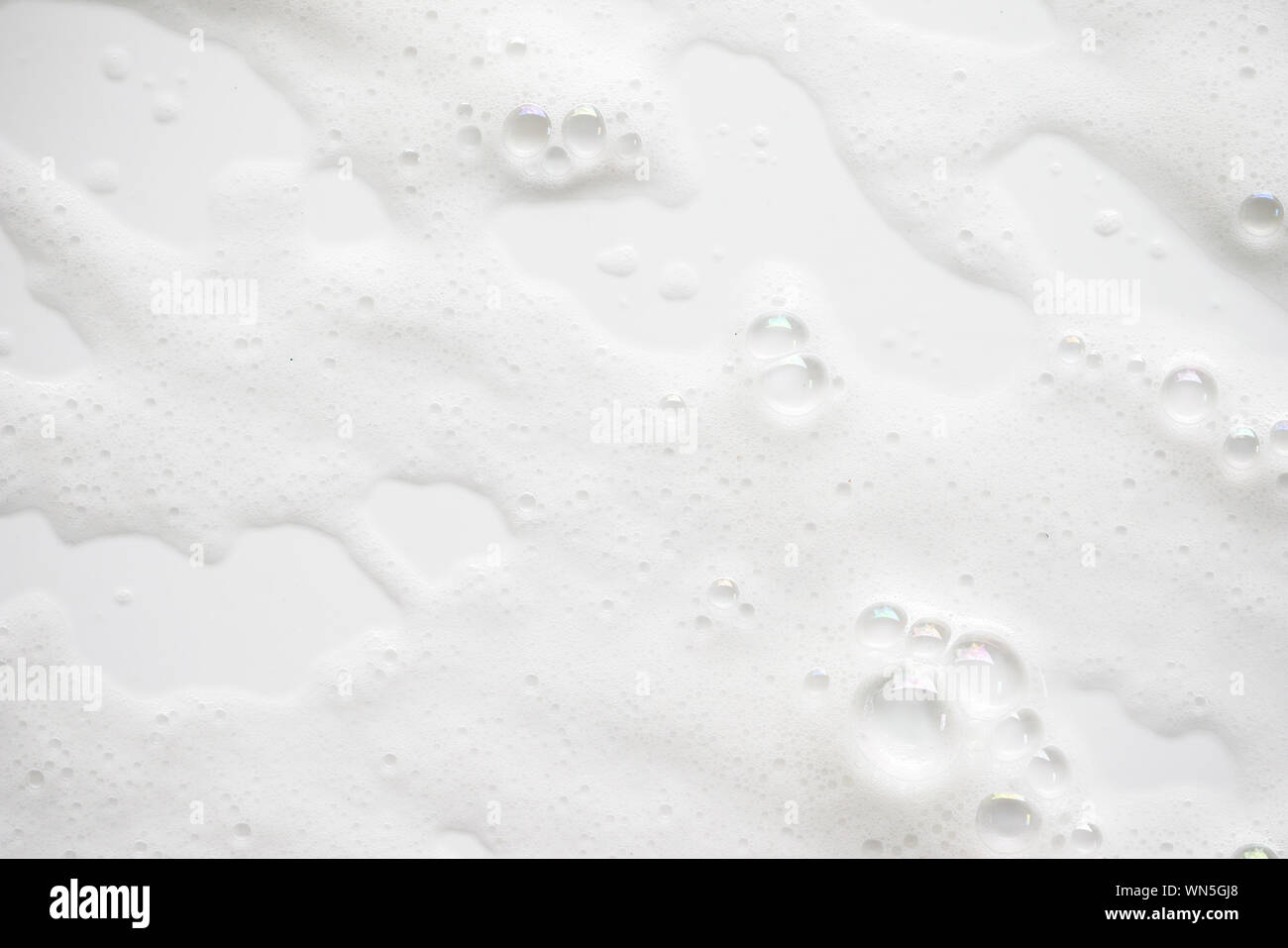 Abstract background white soapy foam texture. Shampoo foam with bubbles ...