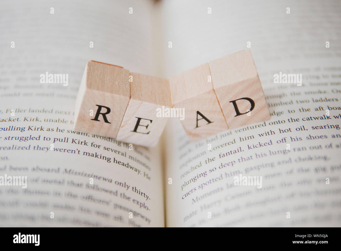 Read in Block Letter on an open book Stock Photo - Alamy