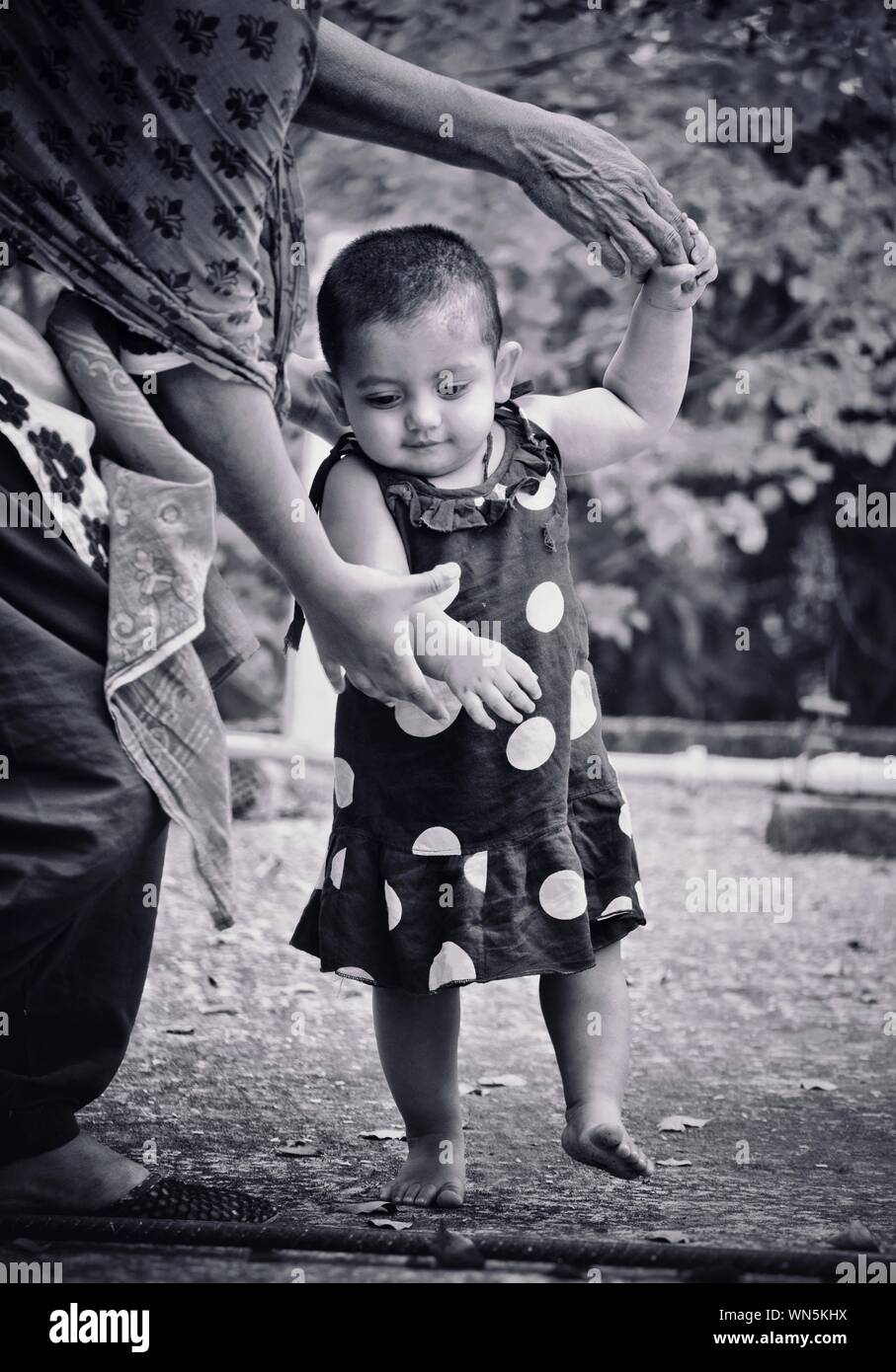 Baby walking hand hi-res stock photography and images - Alamy