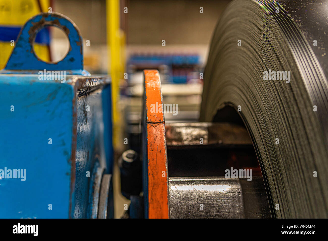 Roll of Sheet steel on machine in metalworks Stock Photo - Alamy