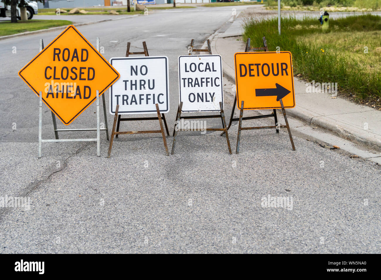 Construction signs on street to direct traffic Stock Photo - Alamy