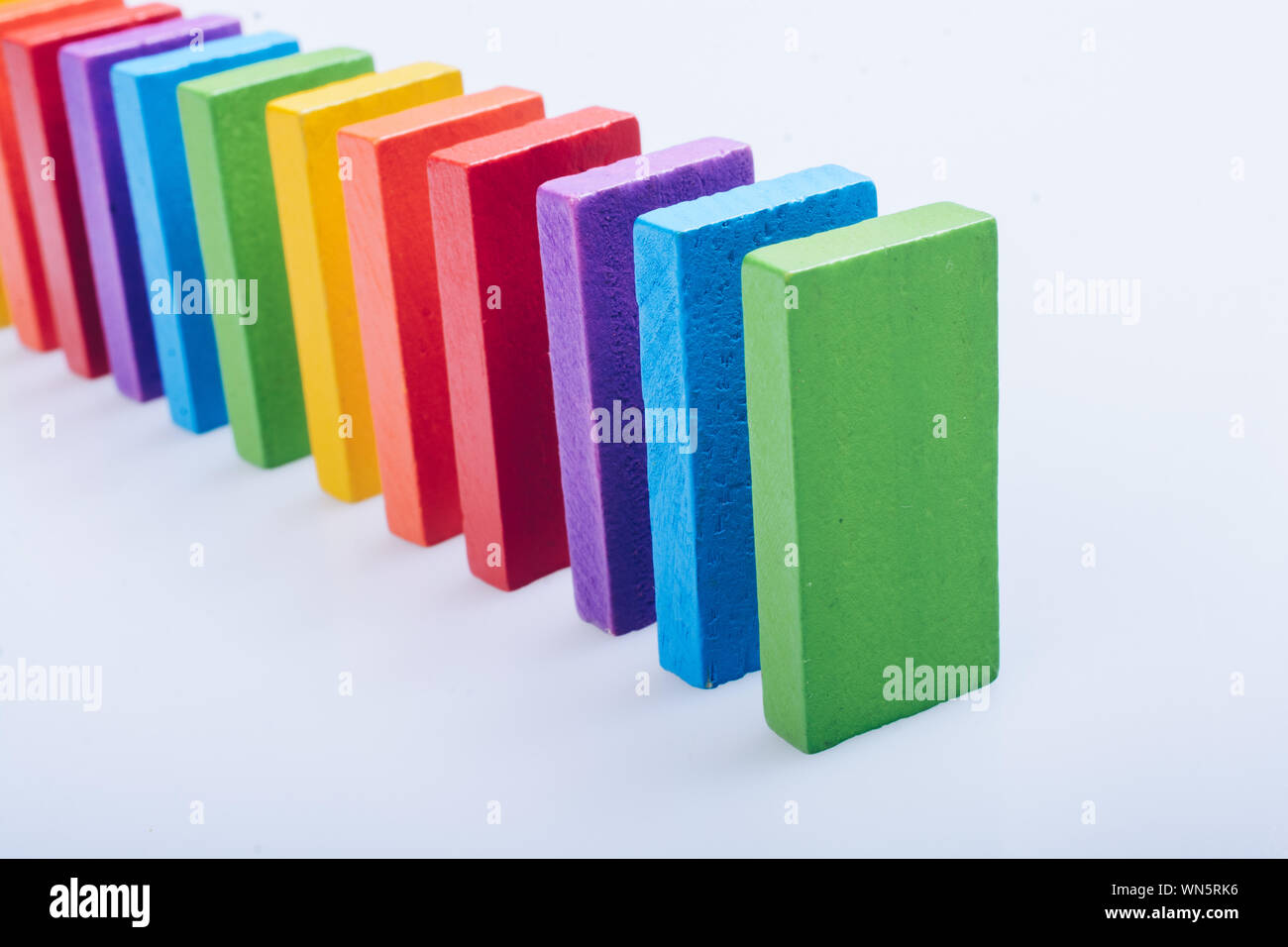 Colorful Domino Blocks placed on a white background Stock Photo - Alamy
