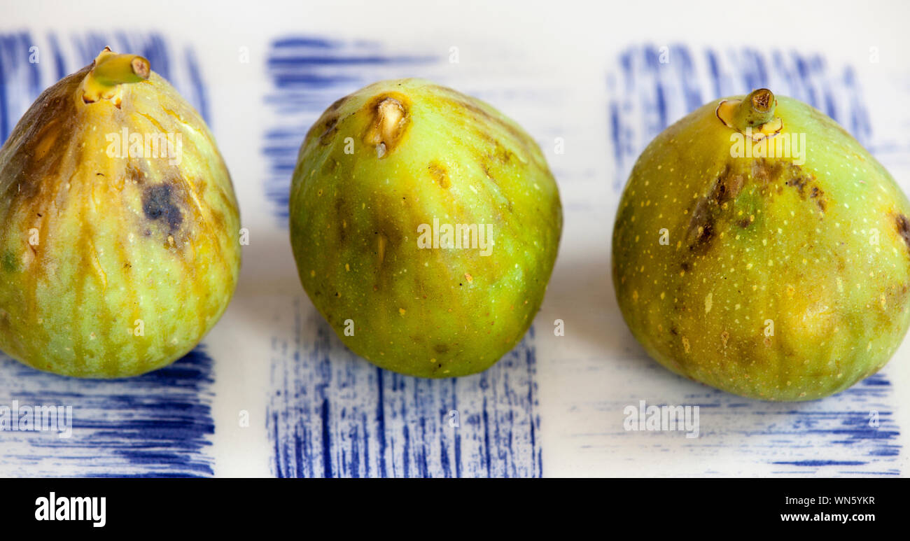 Three figs a isolated on white background Stock Photo - Alamy