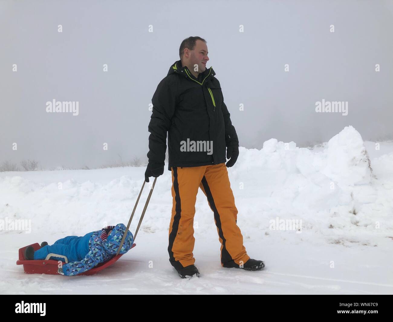 Boys pulling sled hi-res stock photography and images - Alamy